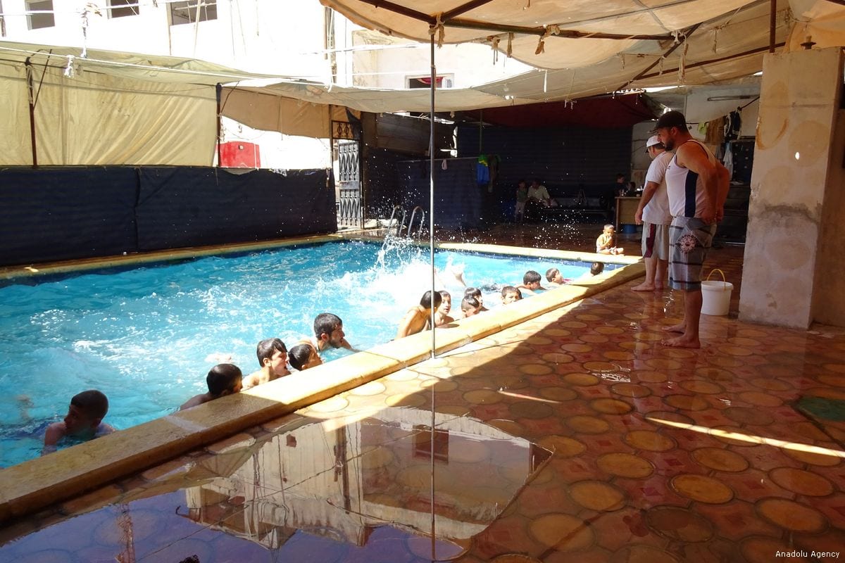 Cooling down in the summer heat in Syria – Middle East Monitor