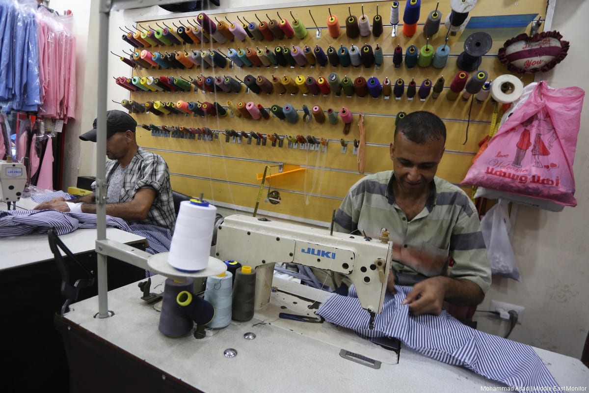 Gaza’s tailors stitch together uniforms for the new school year ...