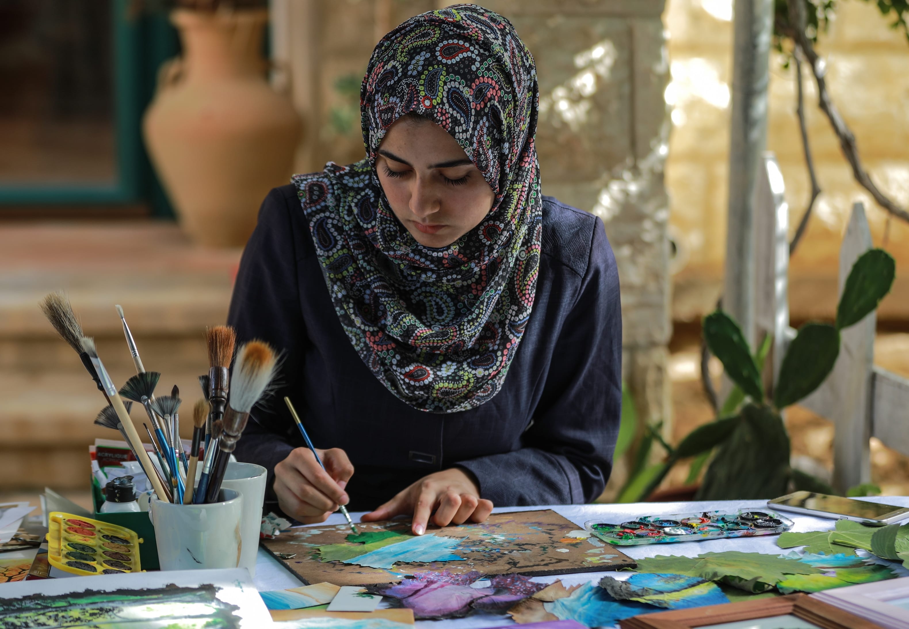 Palestinian girl turns grape leaves into pieces of art – Middle East ...