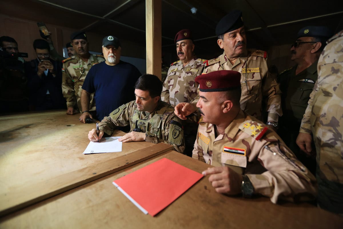 ANBAR, IRAQ – MARCH 19 : Commander of 32nd Brigade Ahmed Qasim (R ...
