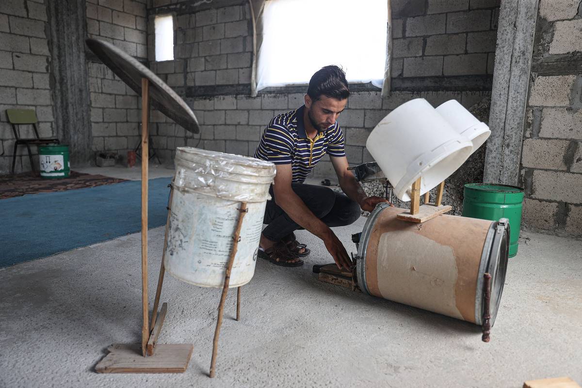 Palestinian young man makes drums from recycled materials in Gaza ...