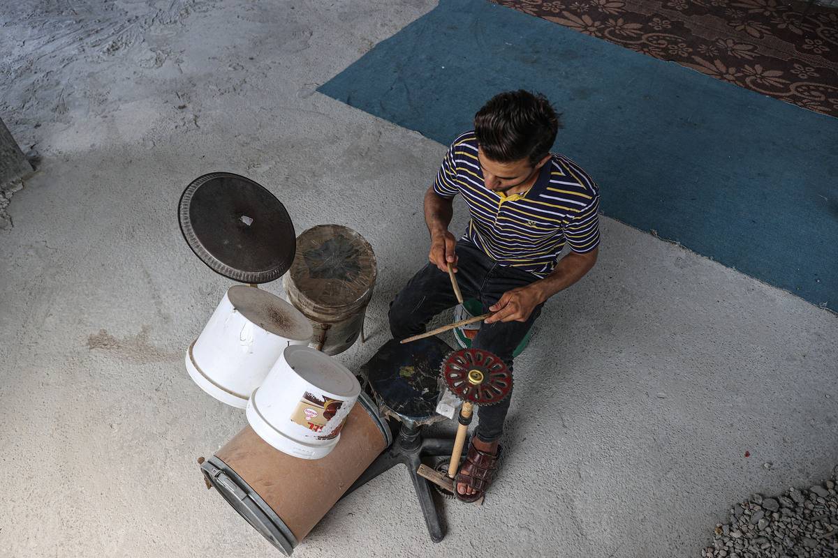 Palestinian young man makes drums from recycled materials in Gaza ...