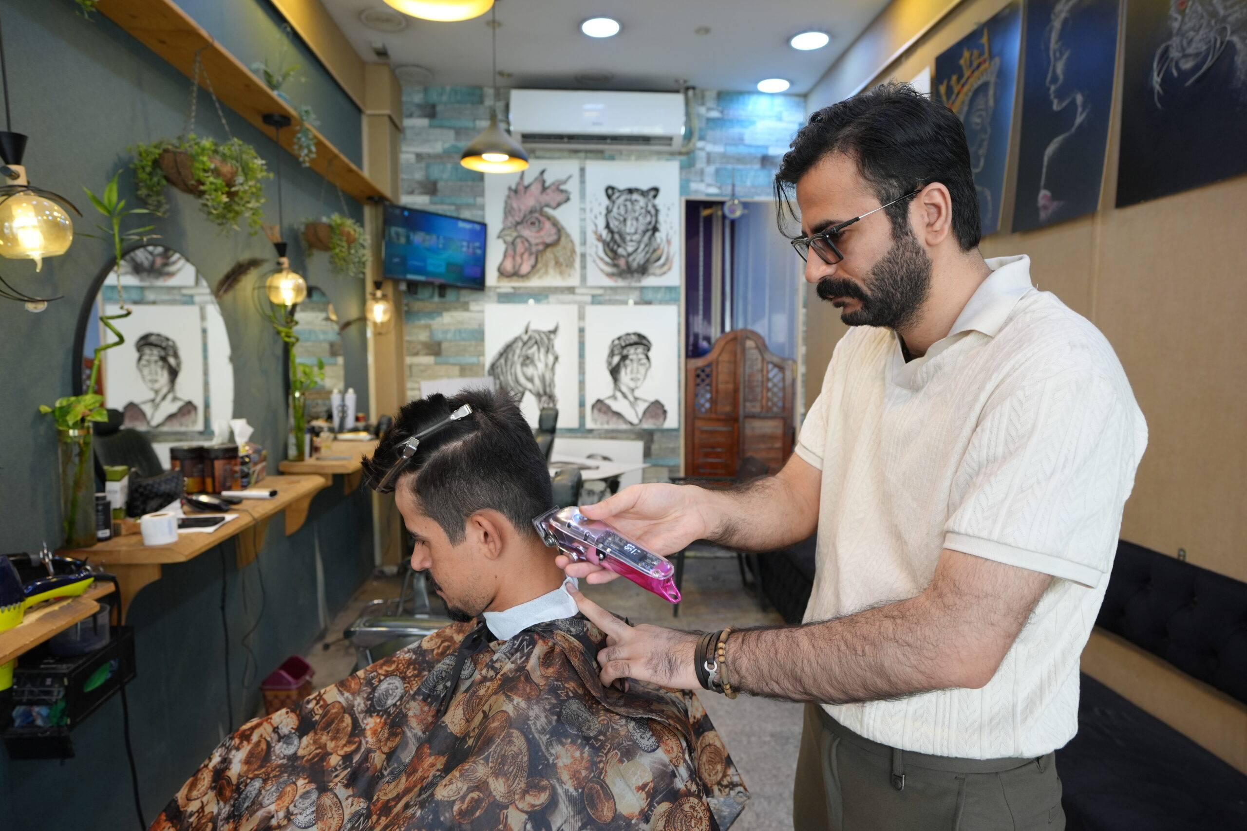 Iraqi barber uses clients’ hair to bring his art to life – Middle East ...