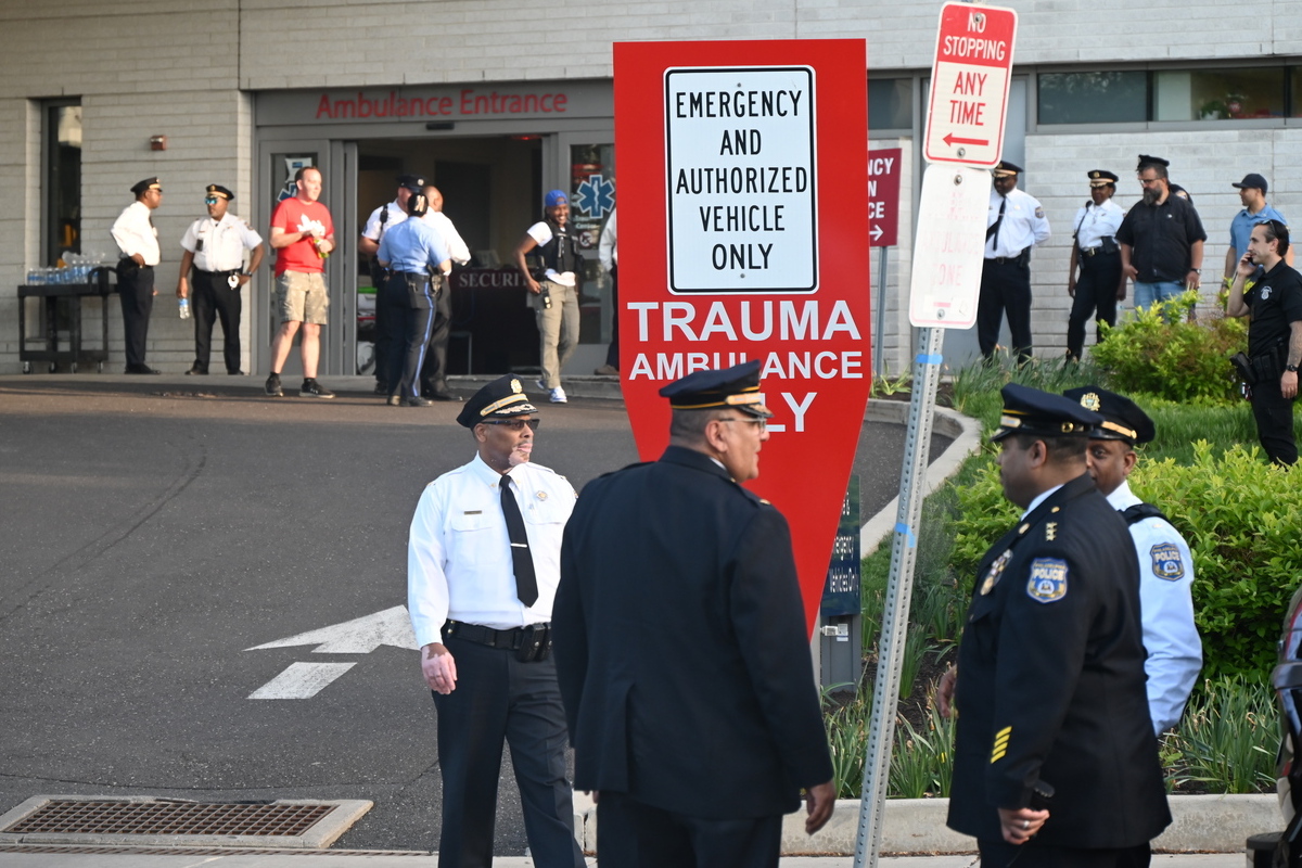 Police officers gather in support outside medical center after officer ...