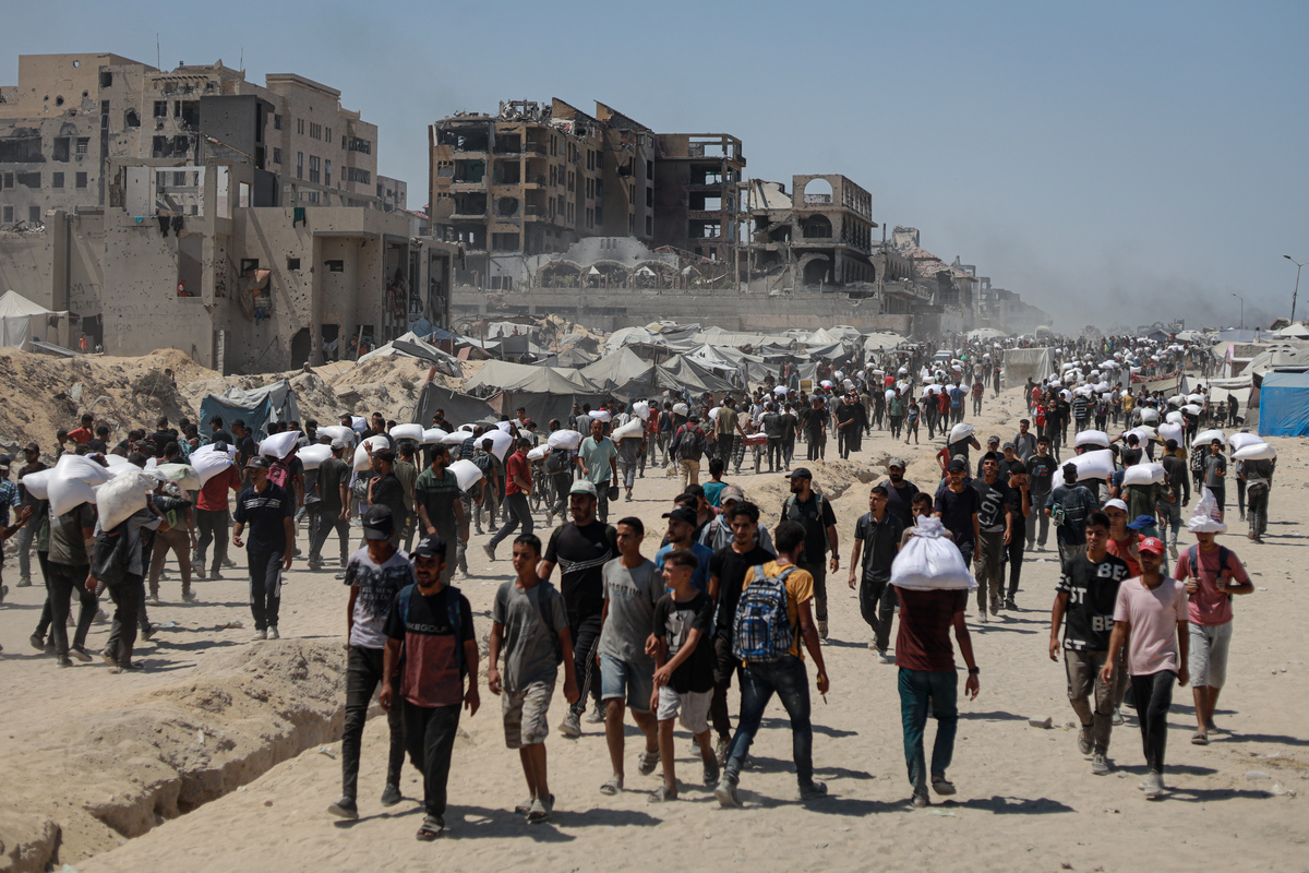 Aid trucks enter Gaza during tactical suspension announced by Israeli ...