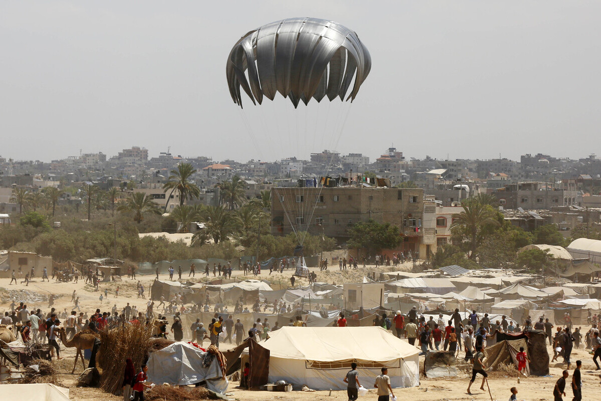 Humanitarian aid parachutes were dropped into Gaza, which is under ...