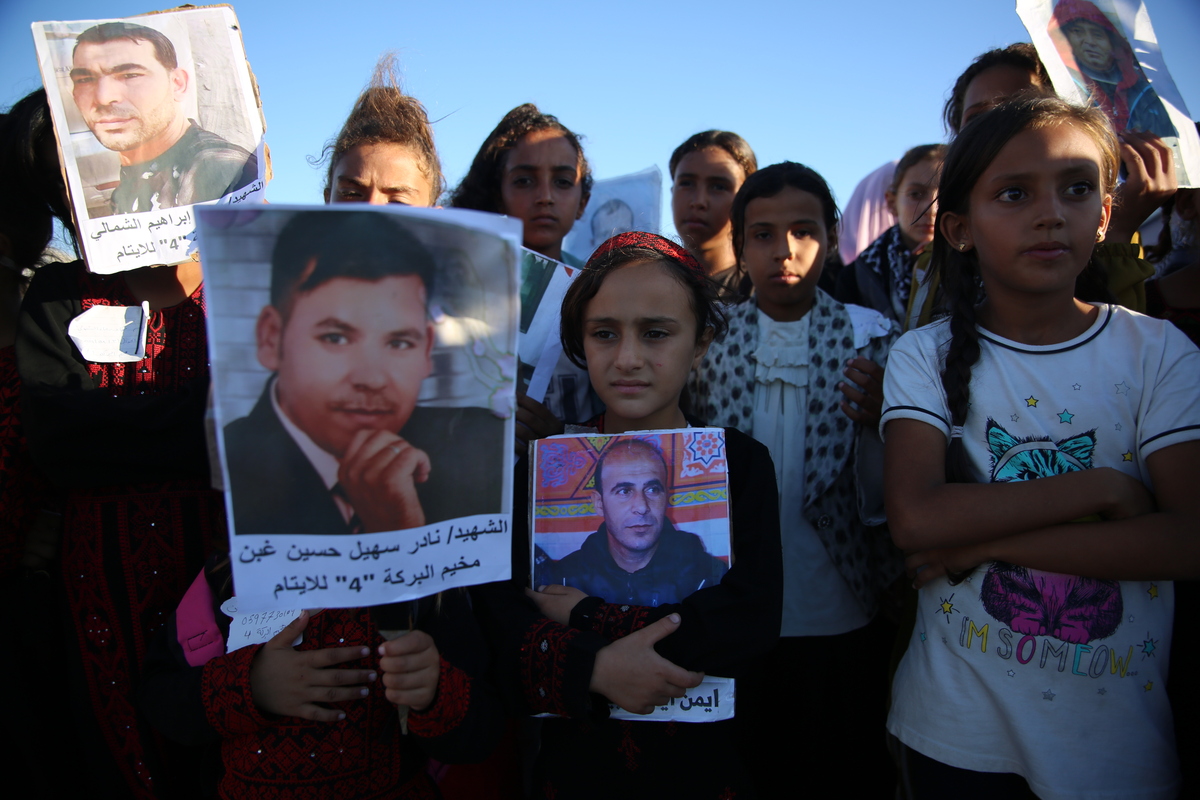 Palestinian children protest Israeli attacks at Khan Yunis orphan camp ...