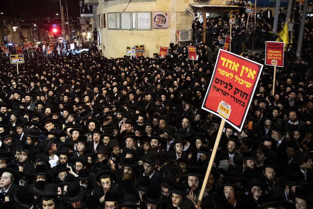 Thousands of Haredi Jews protest mandatory military service in ...