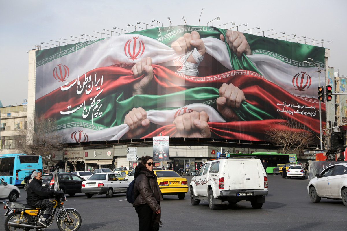Giant banner featuring Iranian flag, hung at Enghelab Square in Tehran ...