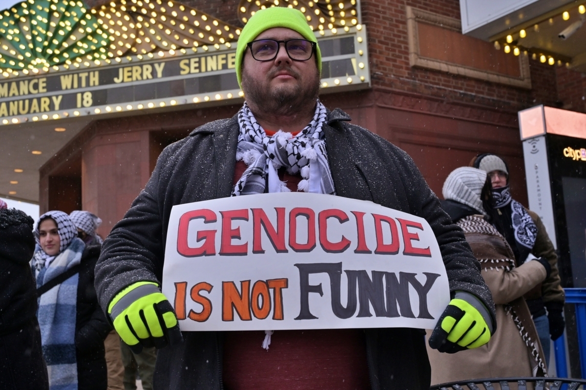 Demonstration in Illinois to protest a benefit performance by comedian ...